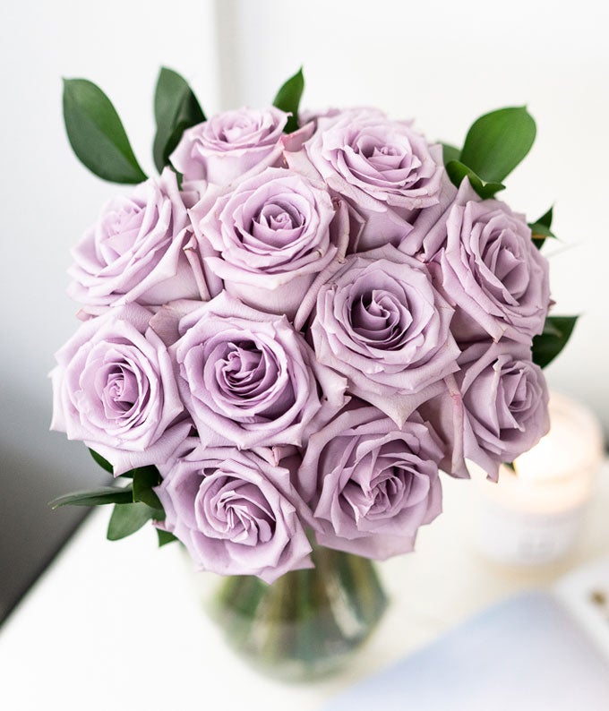 One Dozen Long Stem Purple Roses in a Clear Glass Vase at From You Flowers